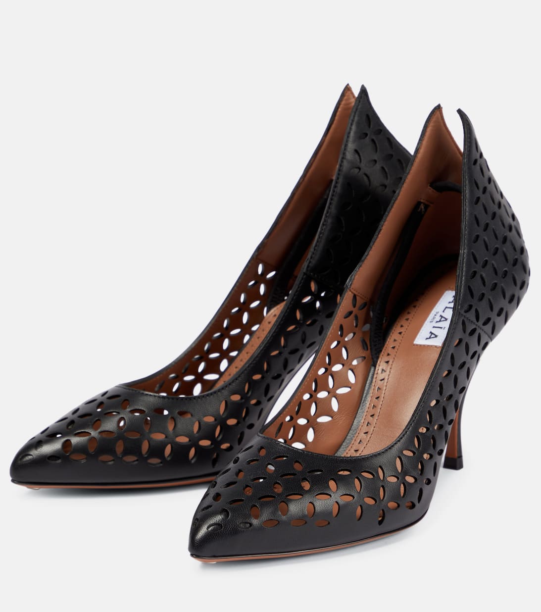 Laser Cut Leather Pumps in Black - Alaia | Mytheresa