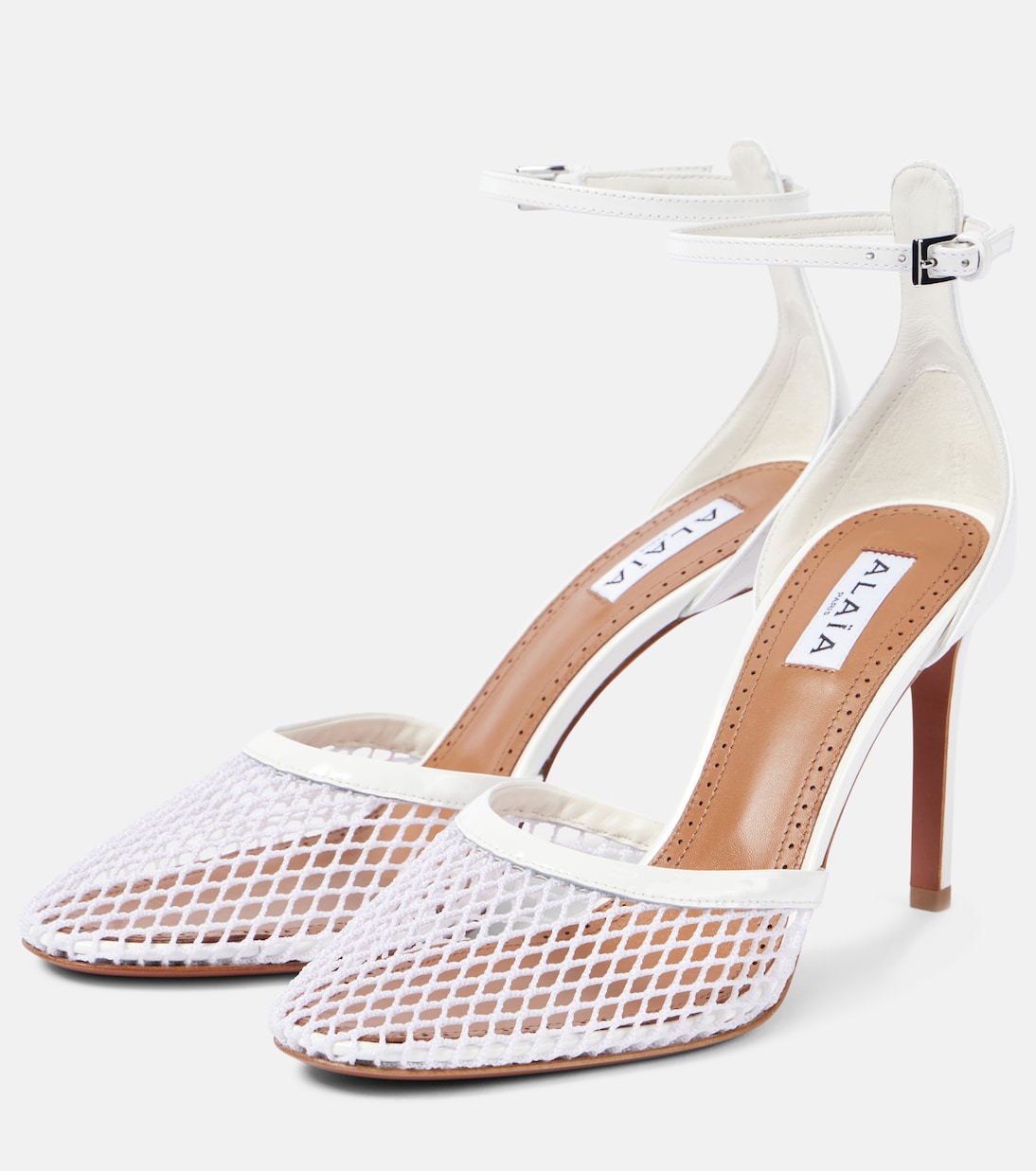 Leather-trimmed mesh pumps in white - Alaia | Mytheresa