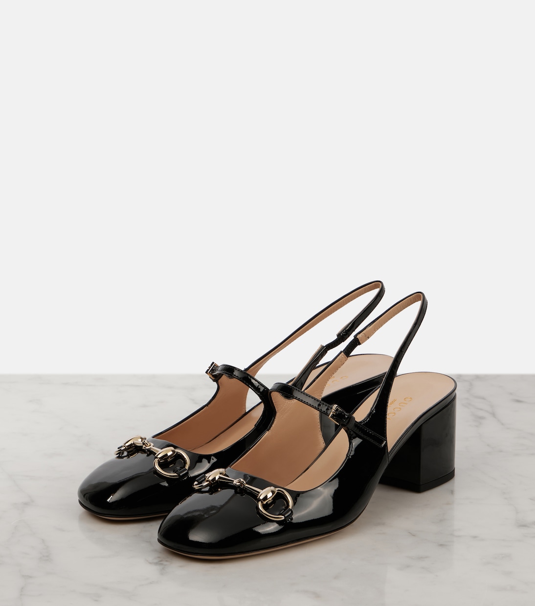 Horsebit 55 patent leather slingback pumps in black - Gucci | Mytheresa