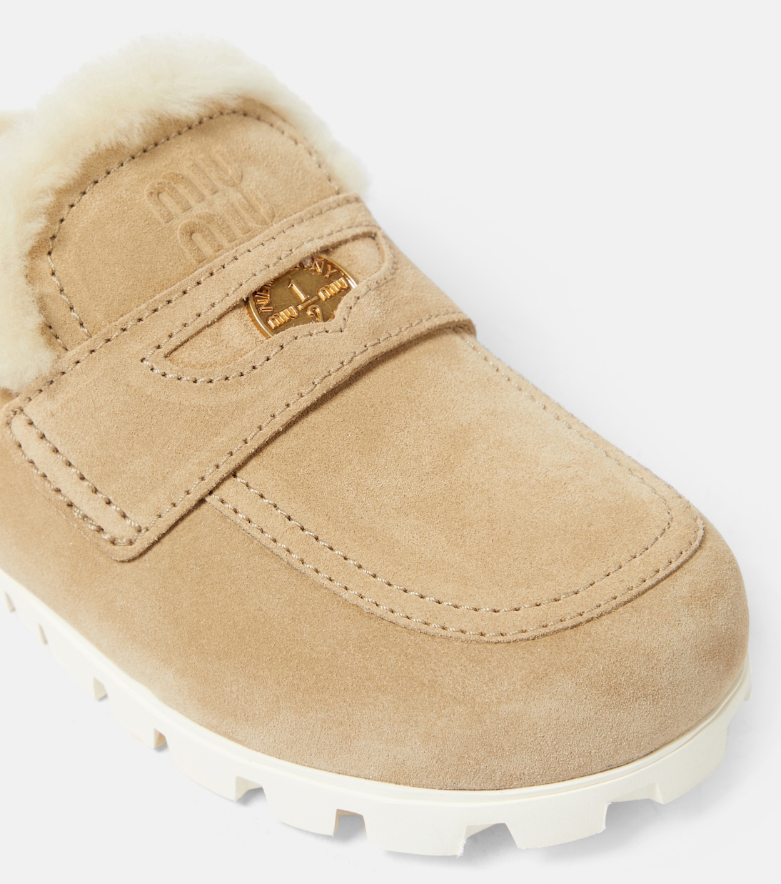 Shearling-lined suede slippers in beige - Miu Miu | Mytheresa