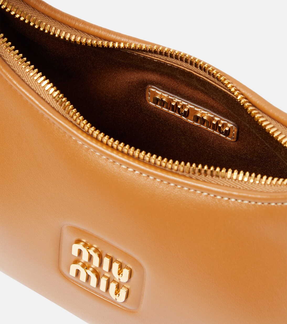 Leather shoulder bag in beige - Miu Miu | Mytheresa