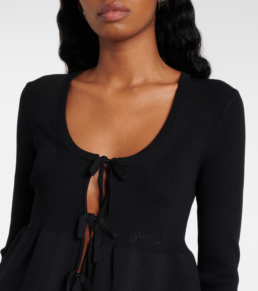 Ruffled ribbed-knit top in black - Ganni | Mytheresa