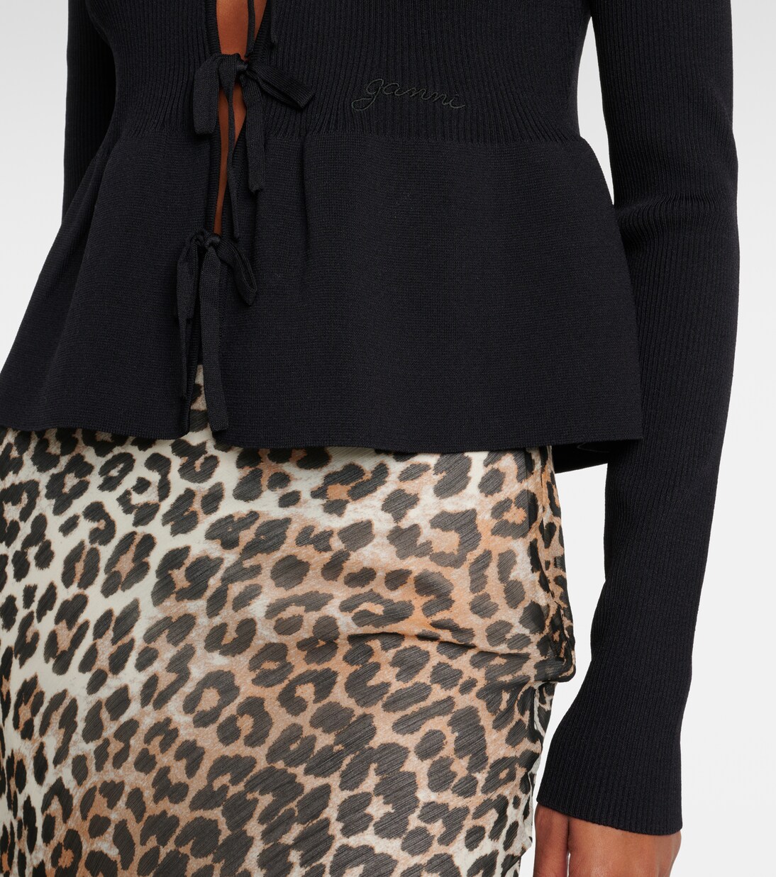 Ruffled ribbed-knit top in black - Ganni | Mytheresa