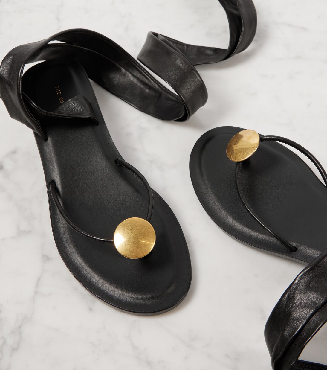 Cord leather thong sandals in black - The Row | Mytheresa