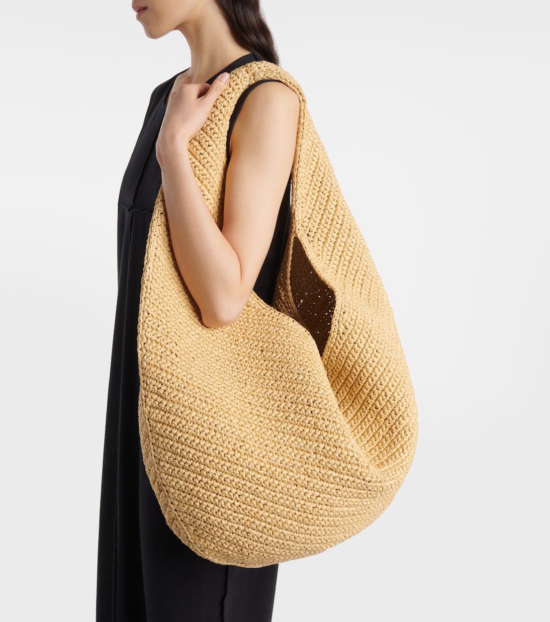 Olivia Large raffia tote bag in beige - Khaite | Mytheresa