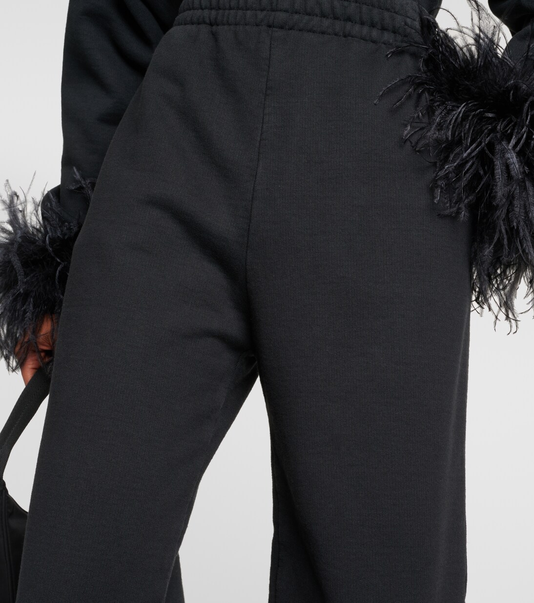 Feather-trimmed cotton sweatpants in black - Prada | Mytheresa