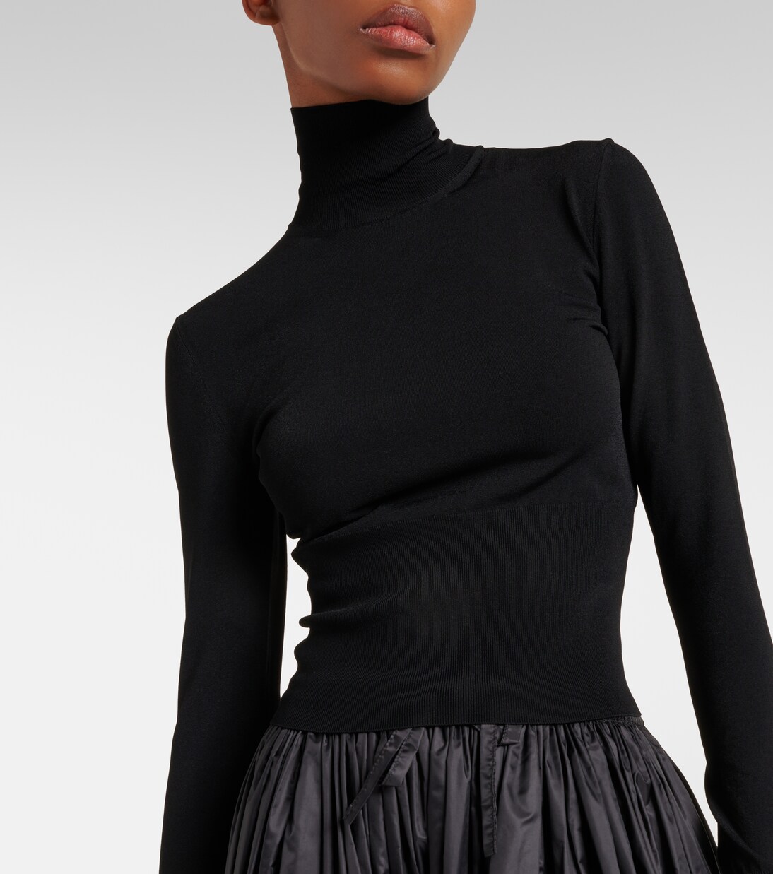 Turtleneck top in black - Alaia | Mytheresa