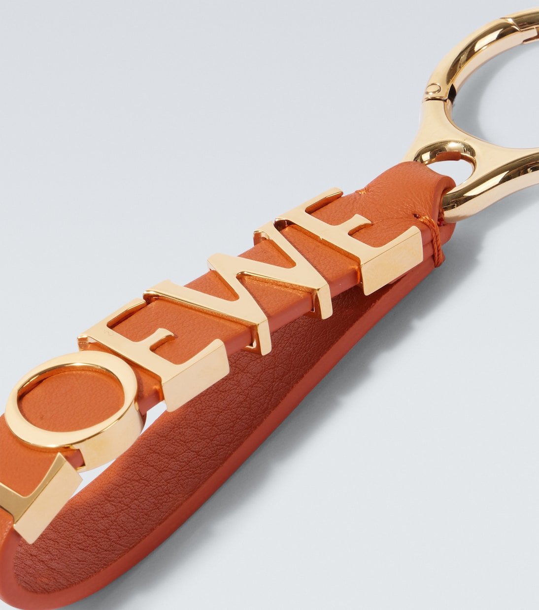 Logo leather bag charm in orange - Loewe | Mytheresa